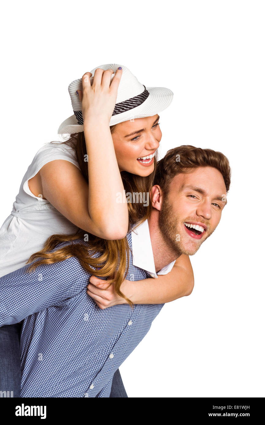Smiling young man carrying woman Stock Photo - Alamy
