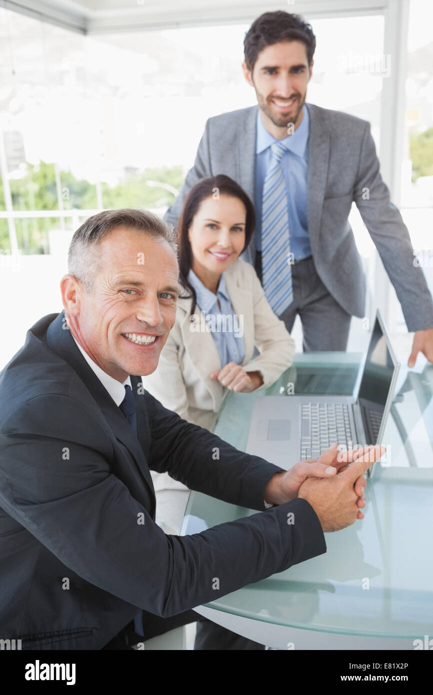Smiling business people at work Stock Photo - Alamy