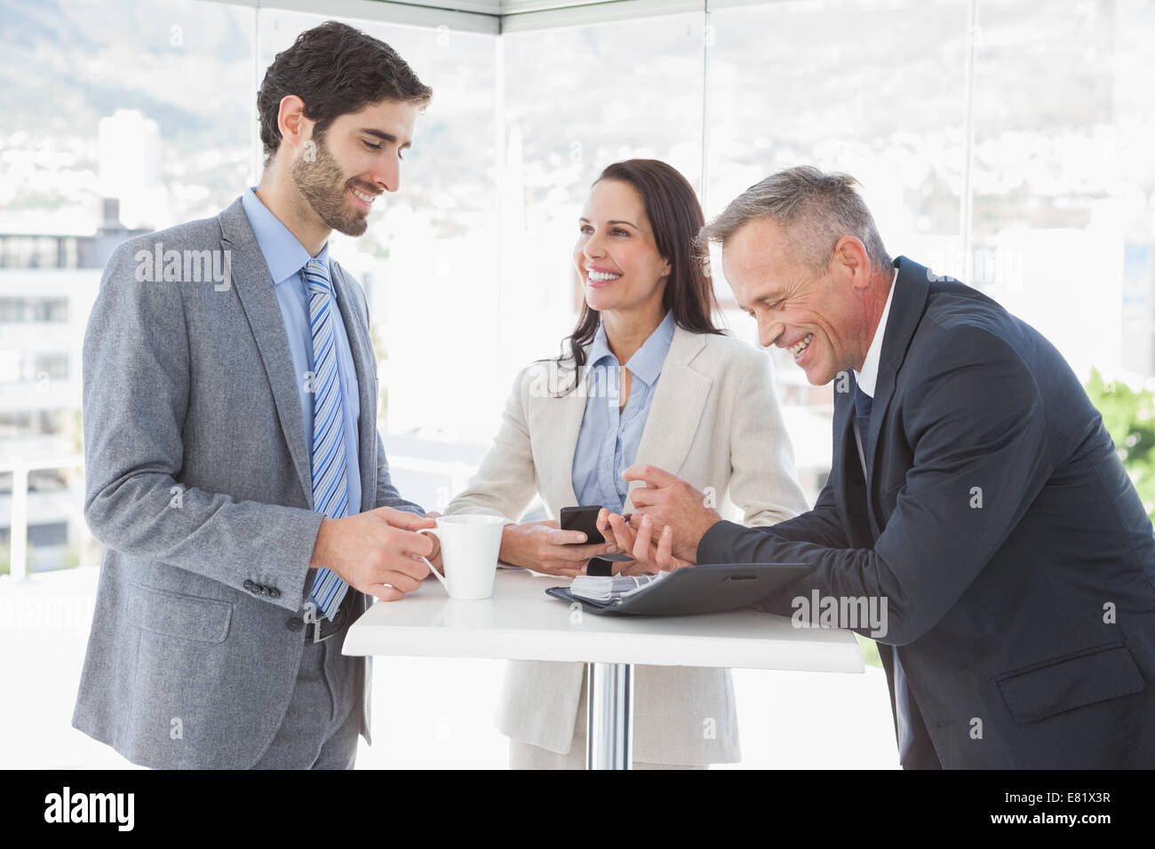 Smiling co workers on their break Stock Photo - Alamy