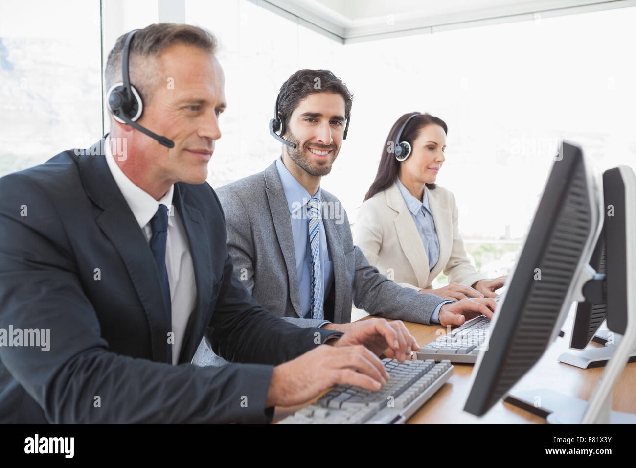 Business team working at a call center Stock Photo - Alamy