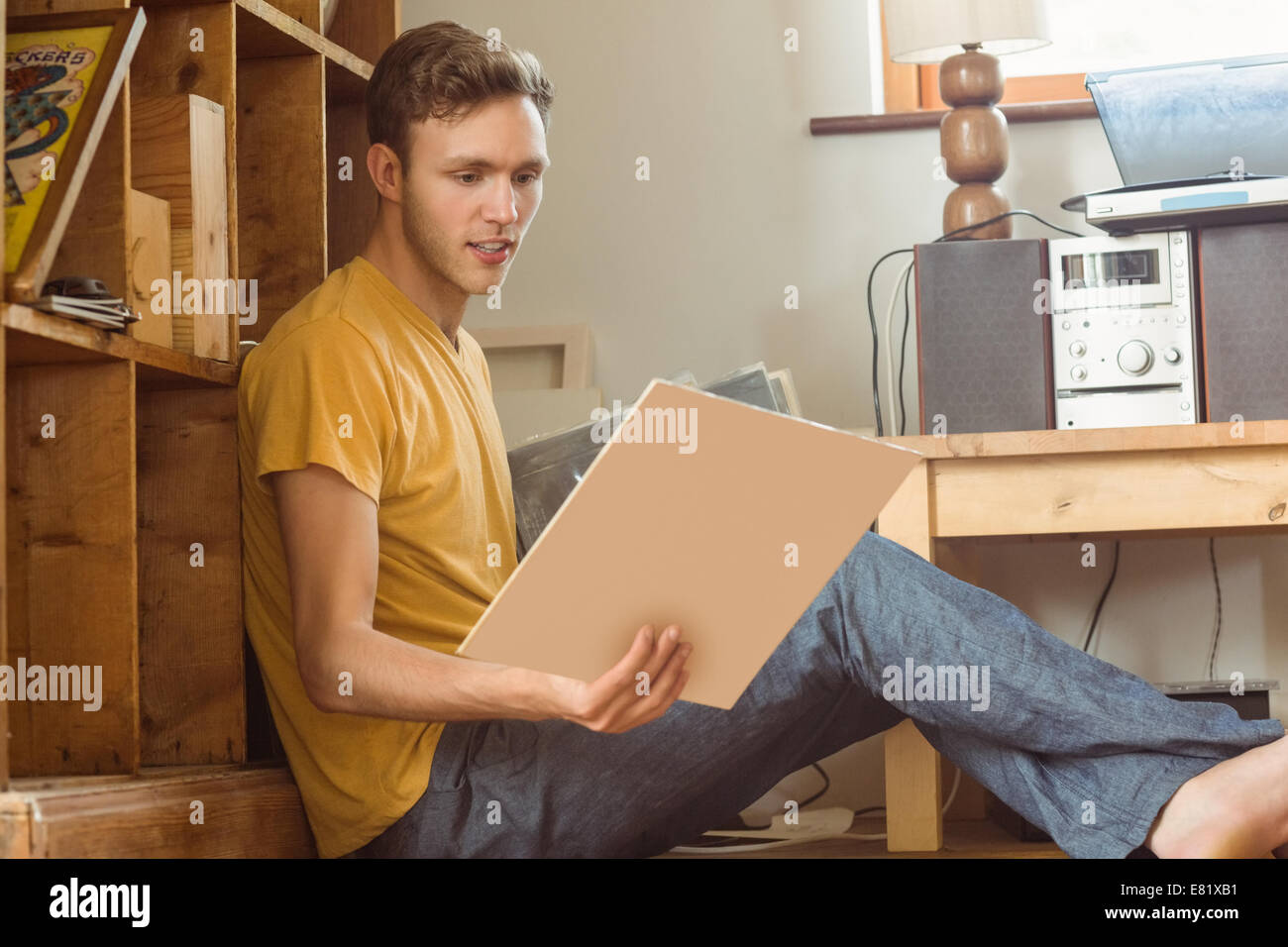 Young man looking at his vinyl collection Stock Photo - Alamy