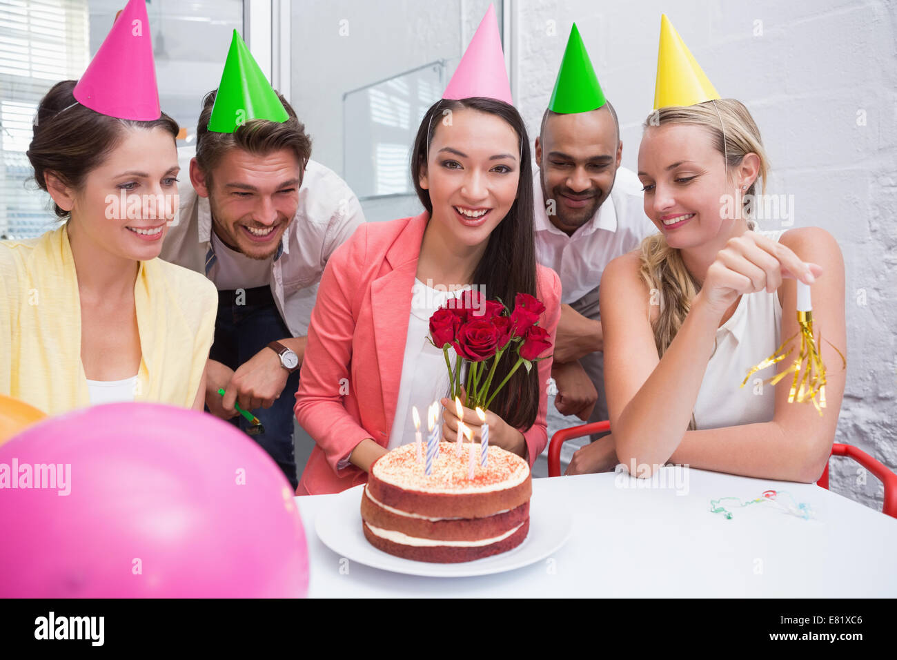 Happy executives celebrating colleagues birthday hi-res stock ...