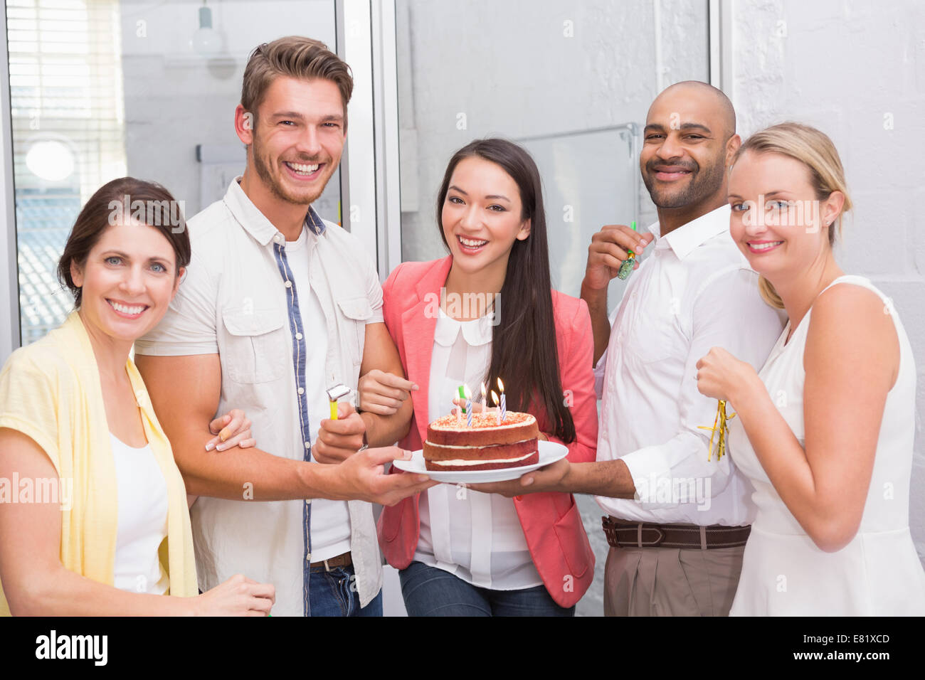 Happy executives celebrating colleagues birthday hi-res stock ...