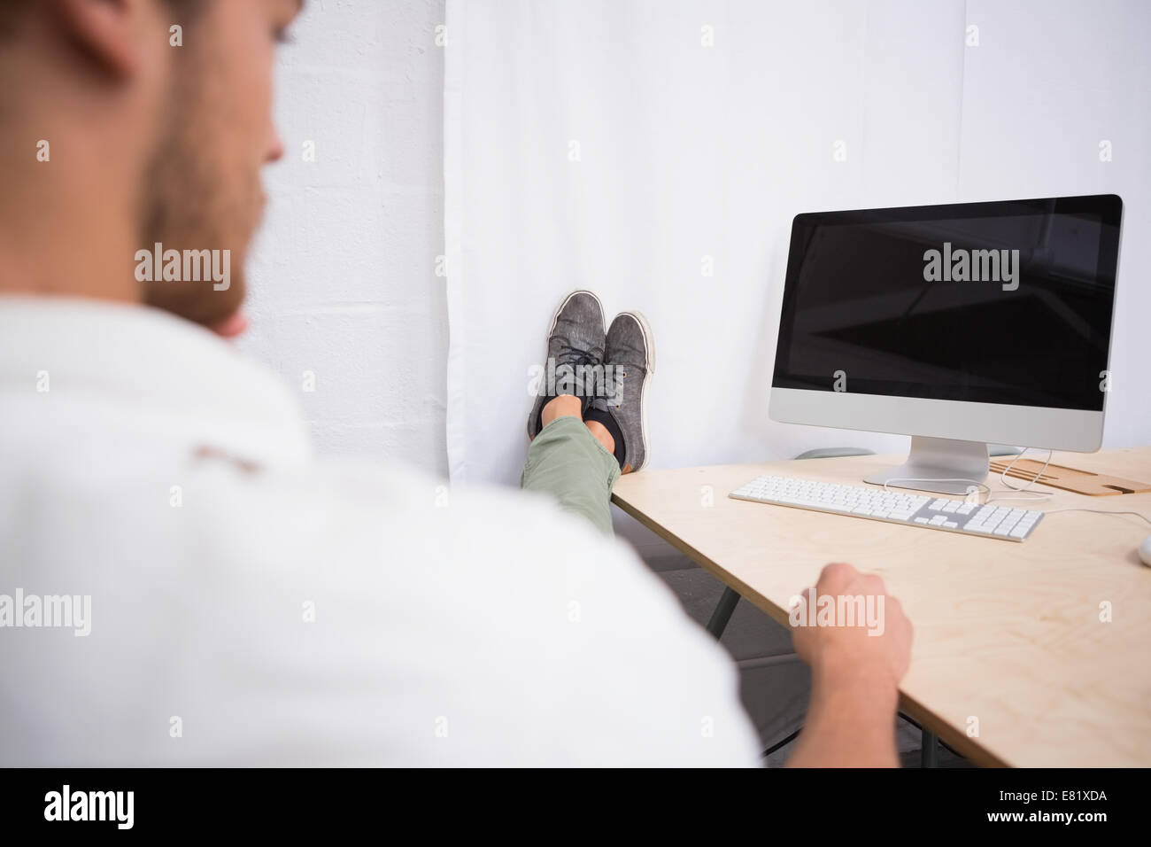Crossed legs desk hi-res stock photography and images - Alamy
