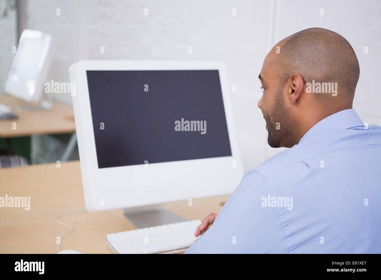 Businessman using computer at office Stock Photo - Alamy