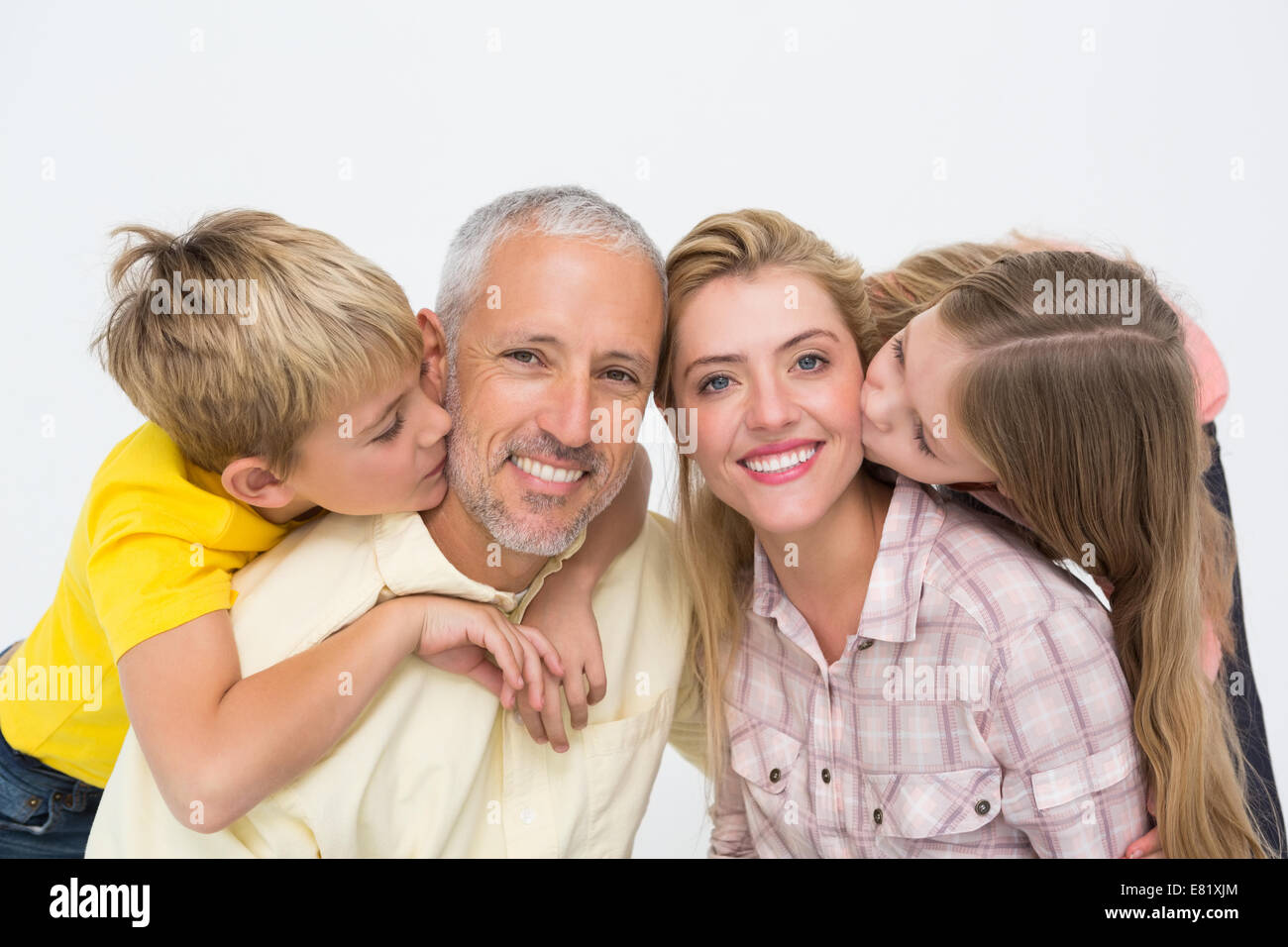 Happy family smiling and showing affection Stock Photo - Alamy