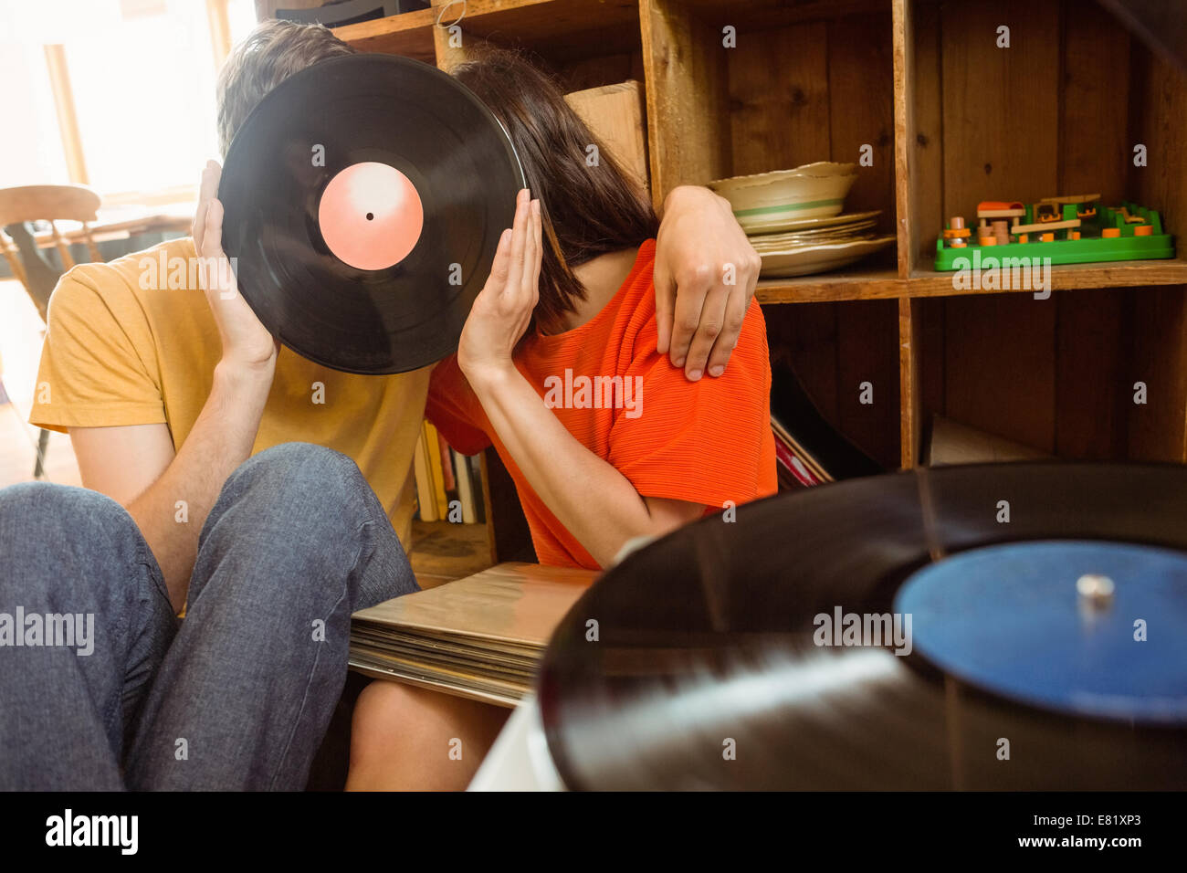 Man hiding face vinyl record hi-res stock photography and images - Alamy