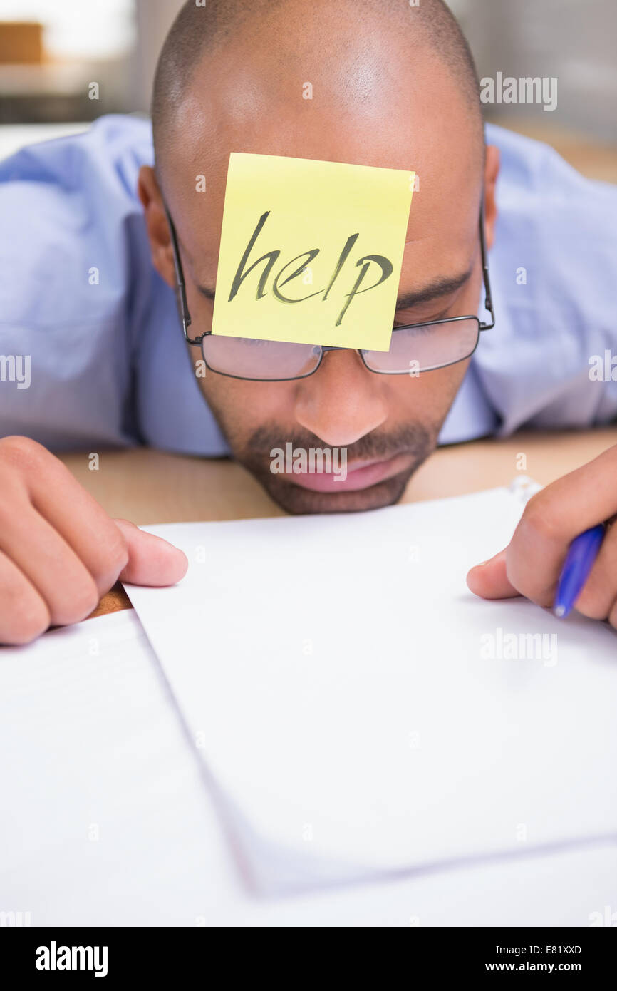 Tired businessman needs help Stock Photo - Alamy