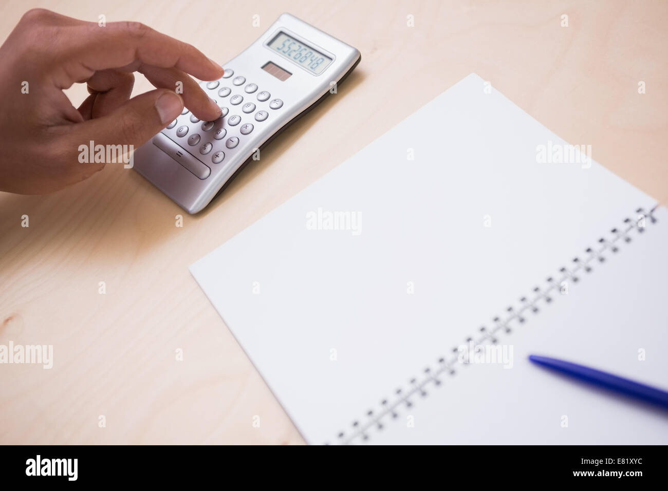 Hand with calculator hi-res stock photography and images - Alamy