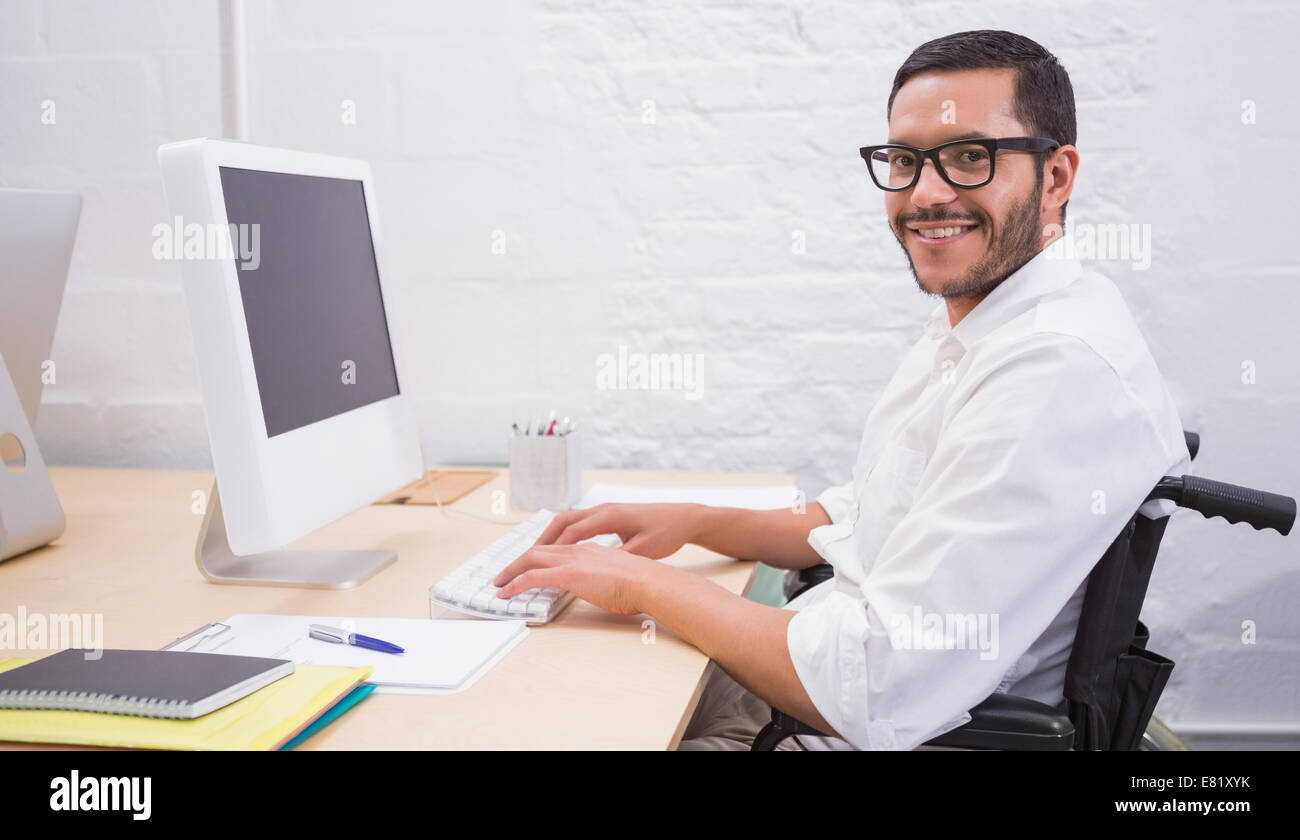 Businessman using computer at office desk Stock Photo - Alamy