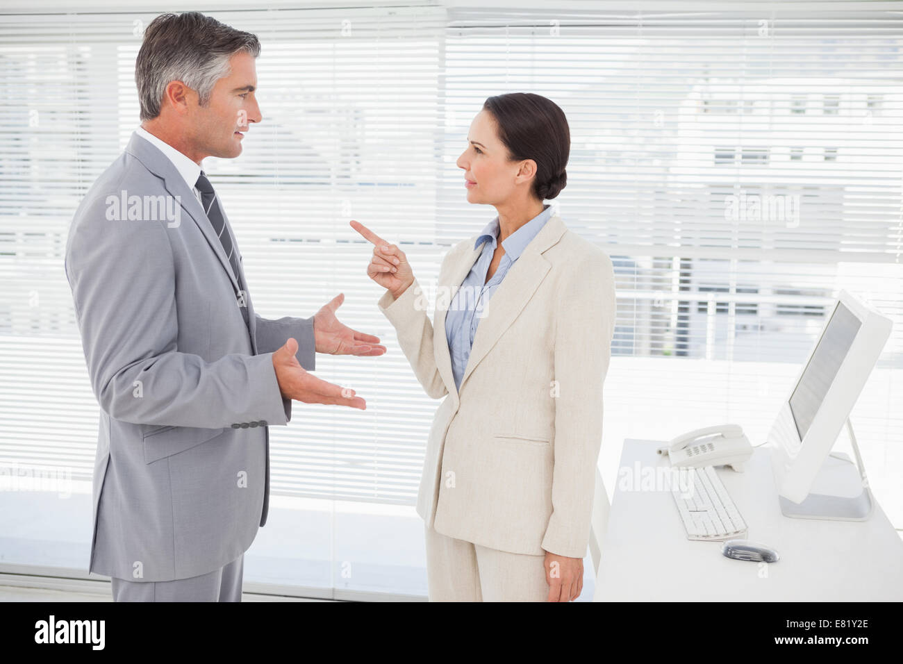 Businesswoman arguing with co worker Stock Photo - Alamy