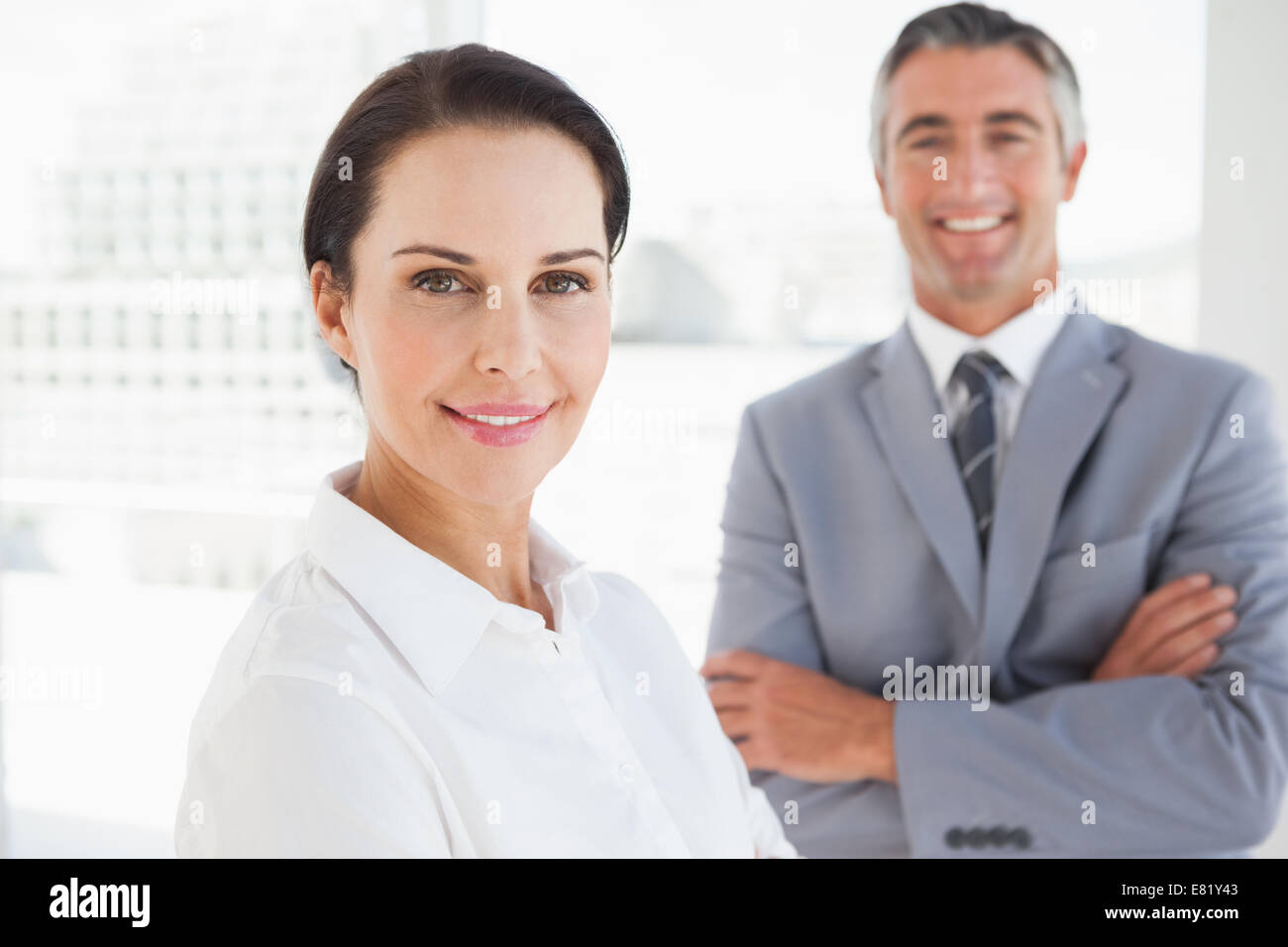 Smiling business woman at work Stock Photo - Alamy