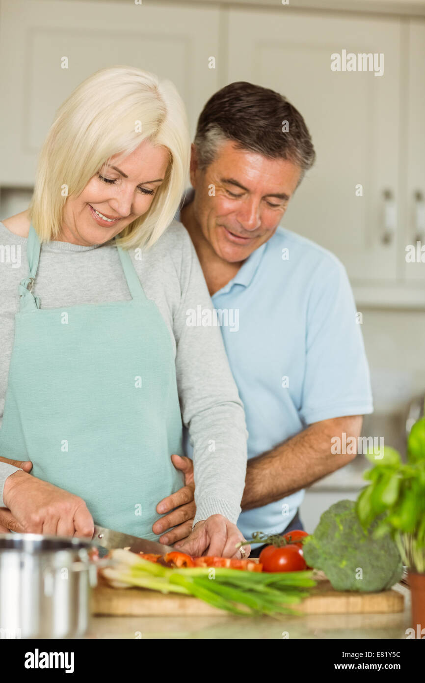 Happy mature couple making dinner together Stock Photo - Alamy