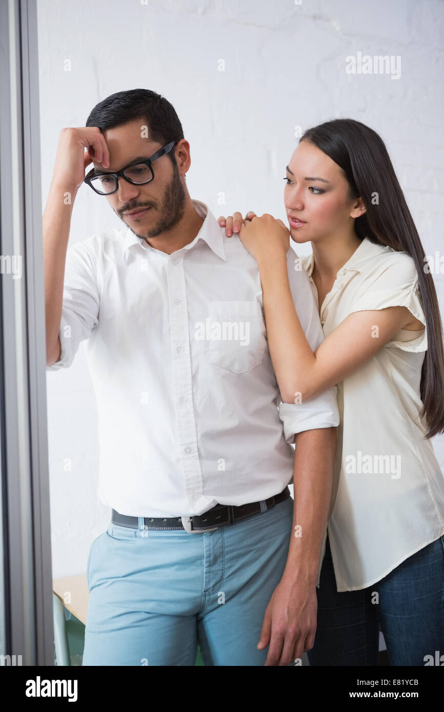 Casual woman consoling friend Stock Photo - Alamy
