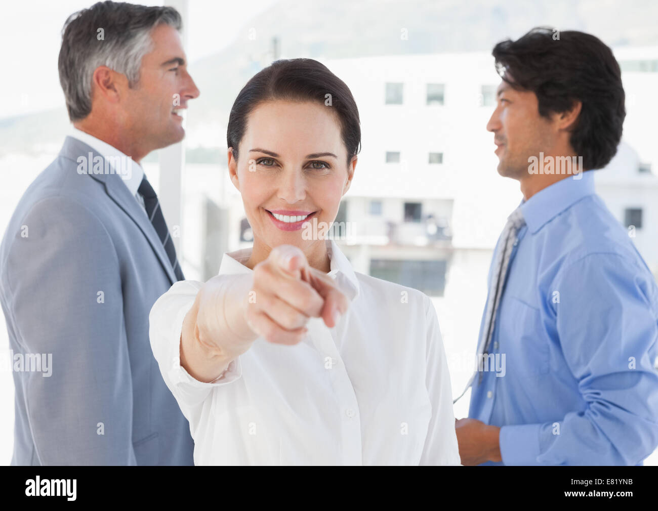 Businesswoman pointing to the camera Stock Photo - Alamy