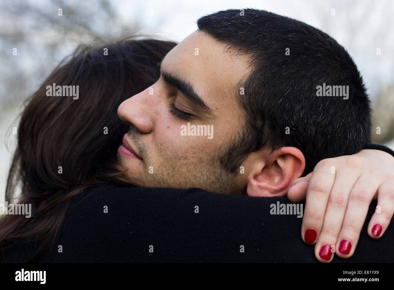 Two persons that are hugging Stock Photo - Alamy