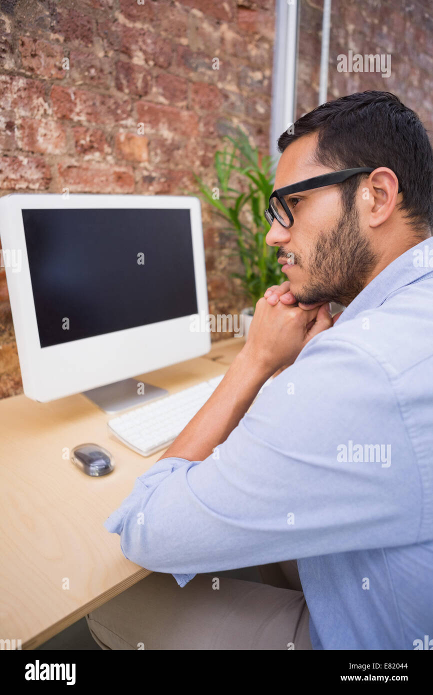 Businessman using computer at desk Stock Photo - Alamy