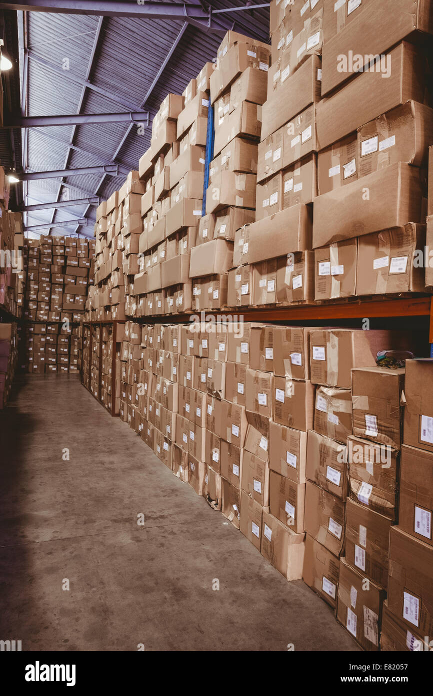 Shelves with boxes in warehouse Stock Photo - Alamy