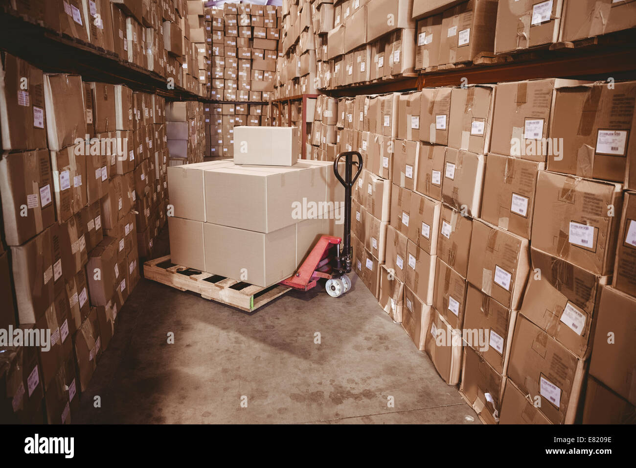 Boxes in warehouse Stock Photo - Alamy