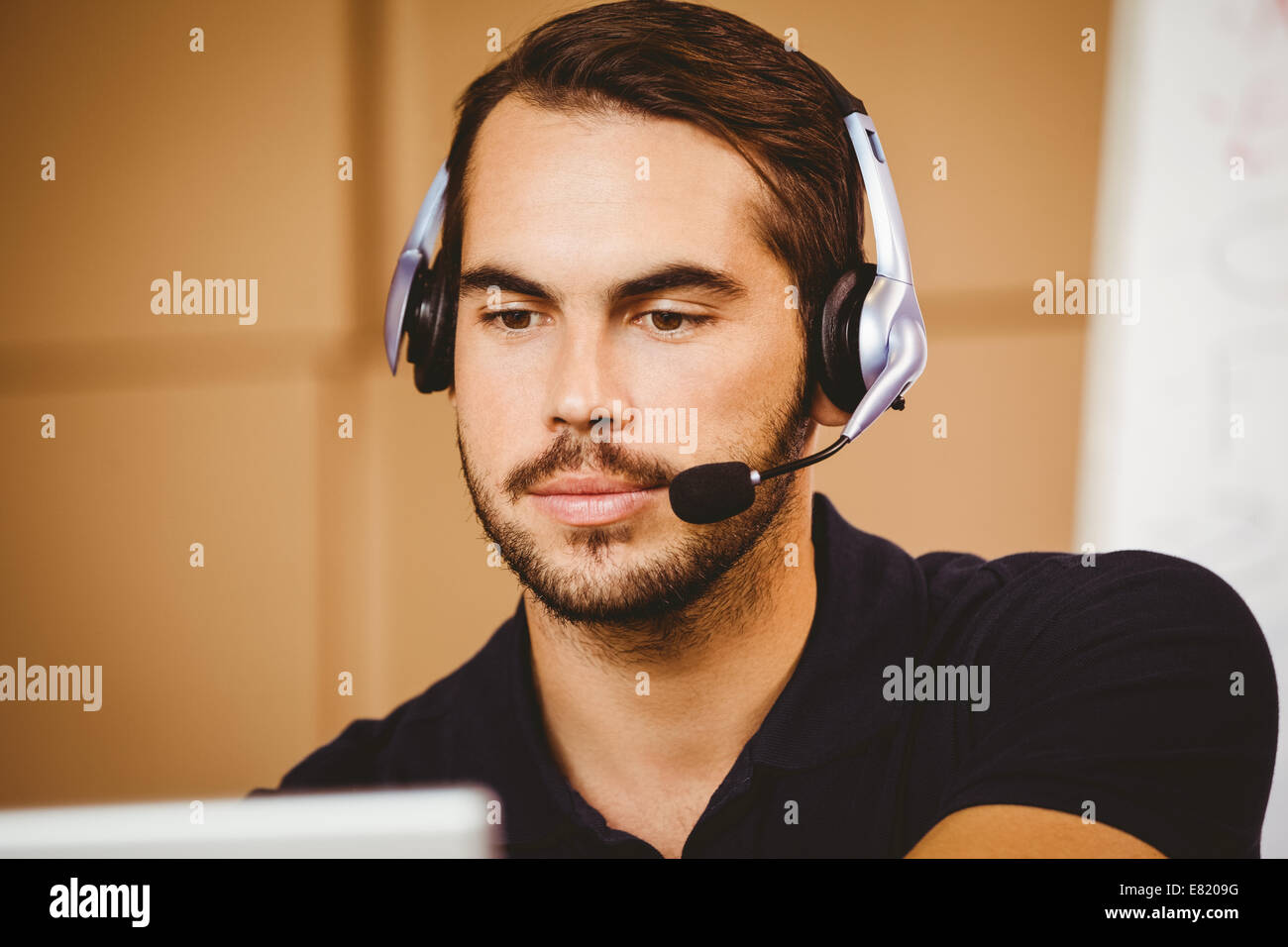 Businessman using headset in distribution warehouse Stock Photo - Alamy