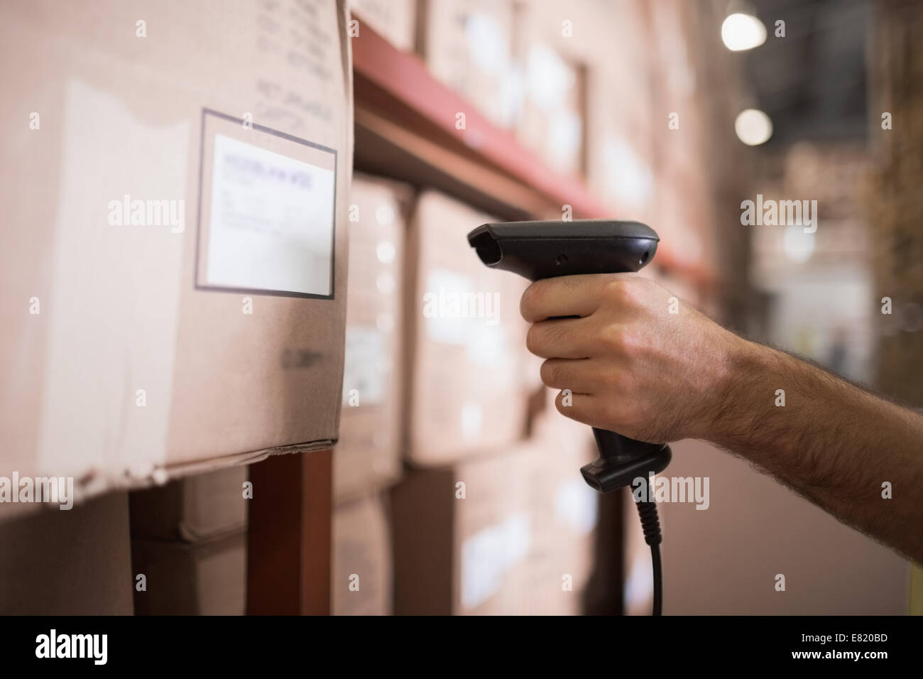 Close up of worker holding scanner in warehouse Stock Photo - Alamy