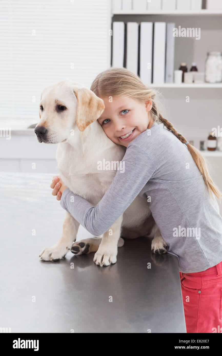 Happy owner hugging her cute dog Stock Photo - Alamy