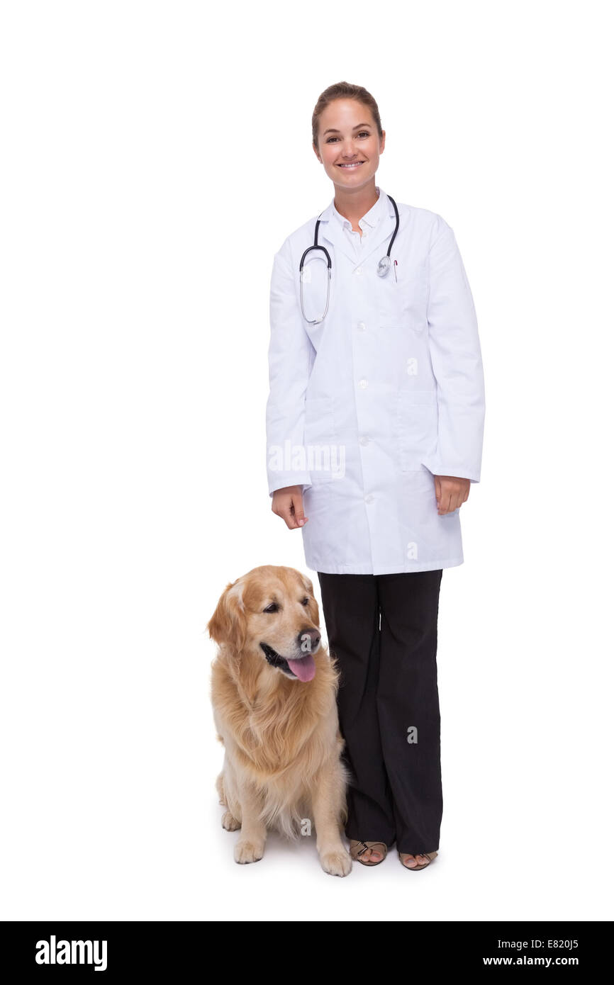 Vet standing with a dog Stock Photo - Alamy