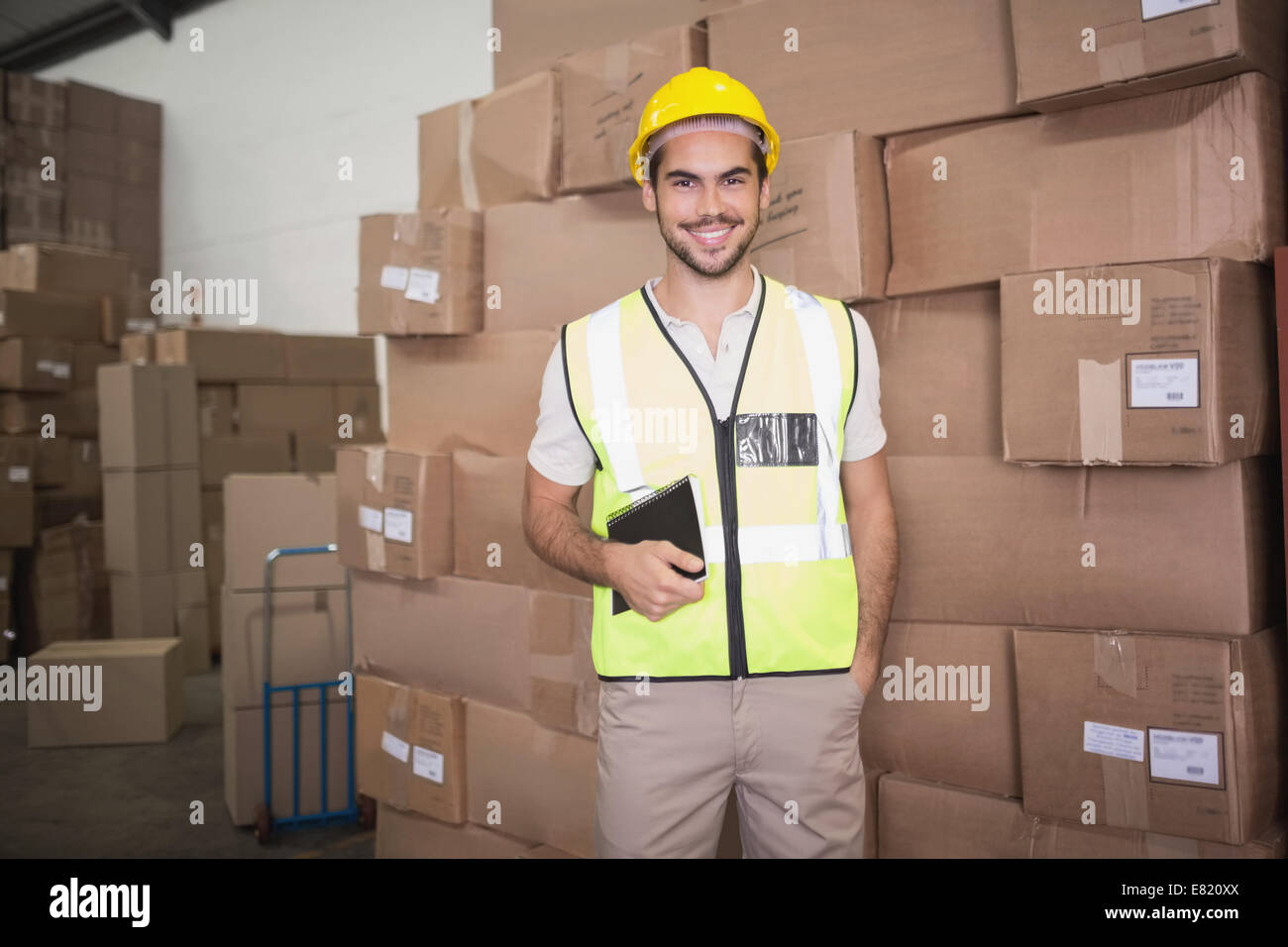 Portrait of worker in warehouse Stock Photo - Alamy