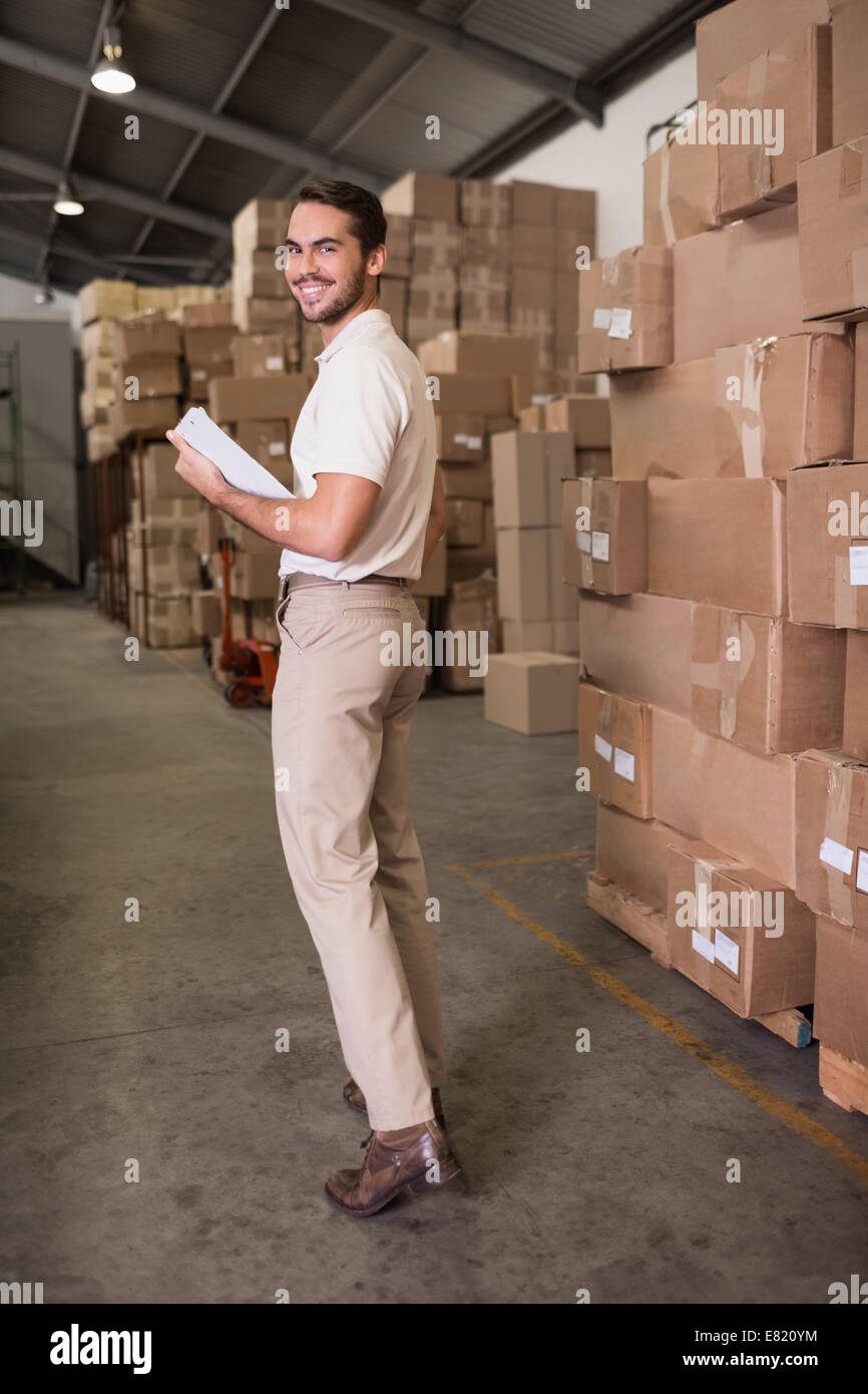 Portrait of warehouse worker with clipboard Stock Photo - Alamy