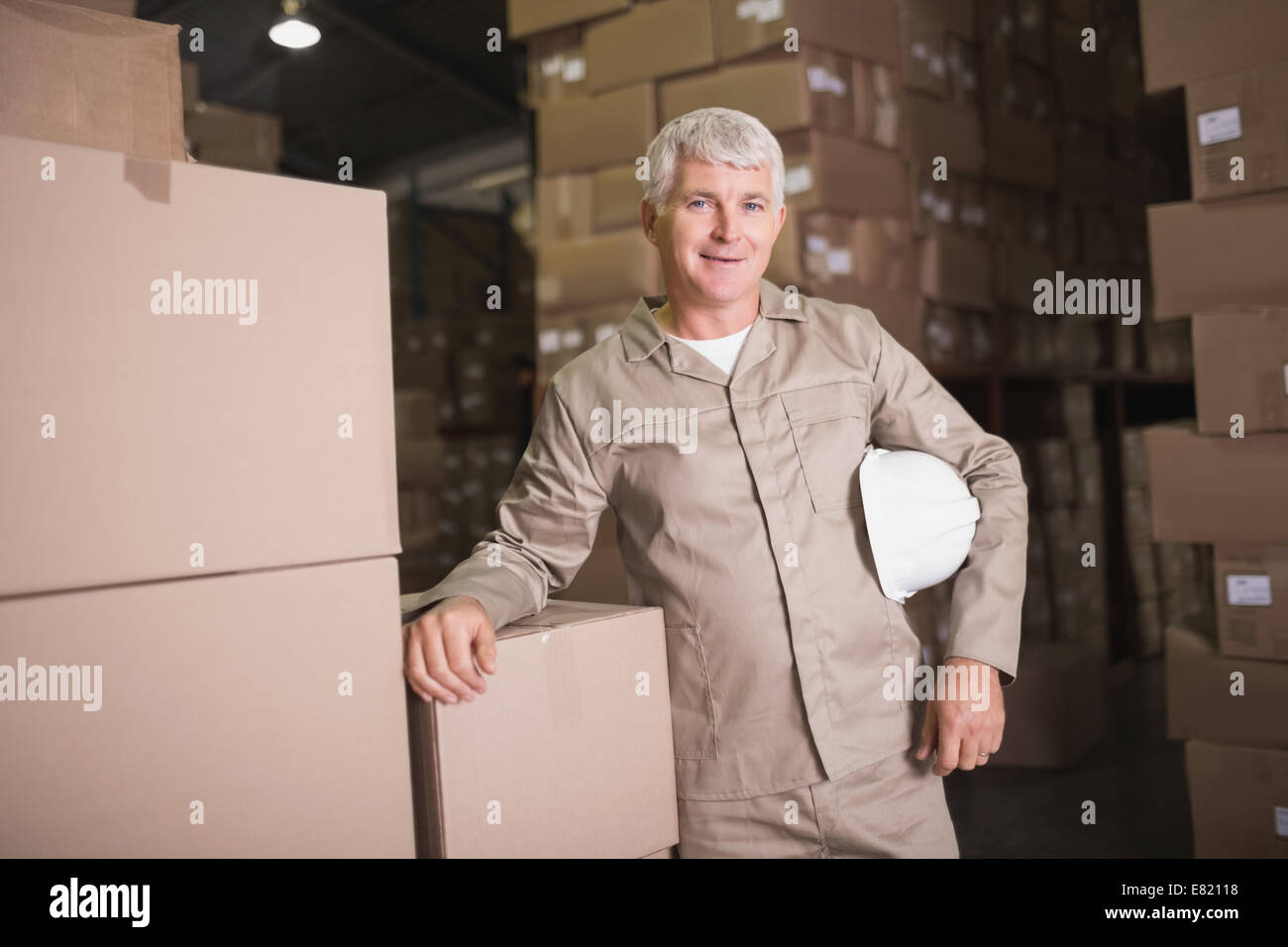 Portrait of confident worker in warehouse Stock Photo - Alamy