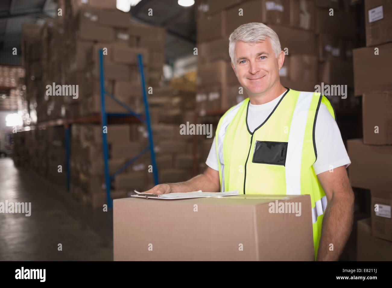 Manual worker in warehouse Stock Photo - Alamy