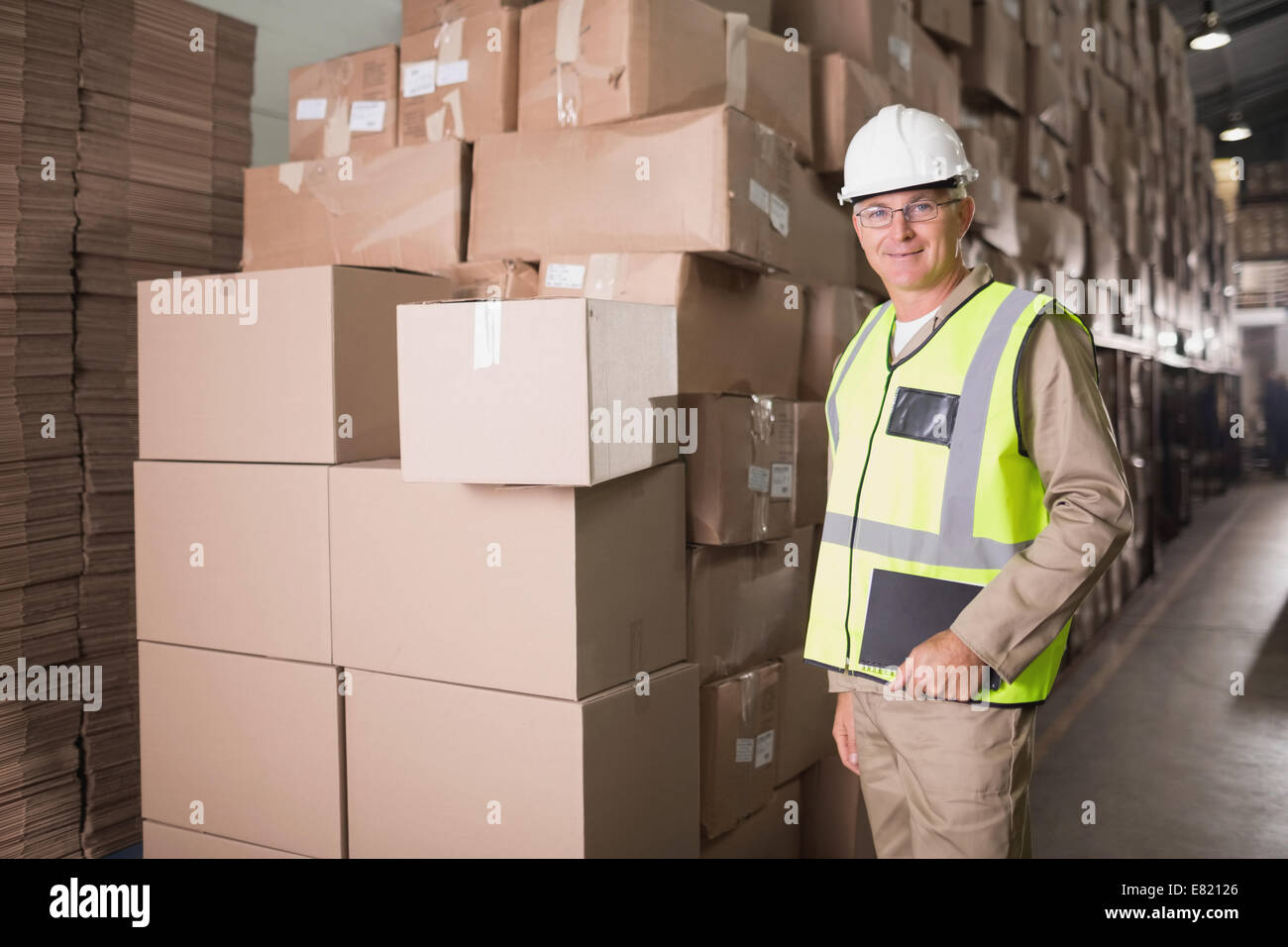 Portrait of manual worker in warehouse Stock Photo - Alamy