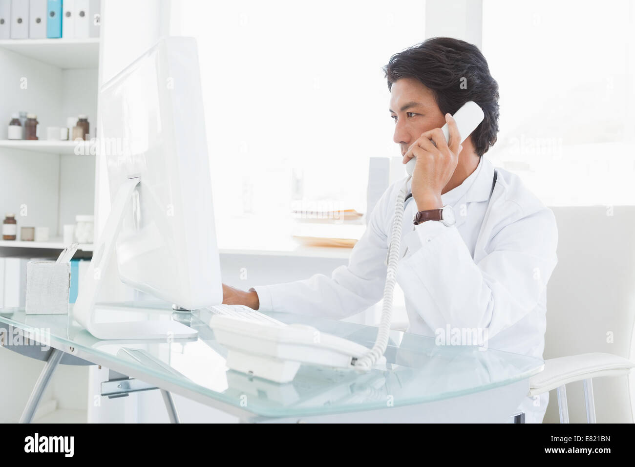 Doctor making work phone calls Stock Photo - Alamy