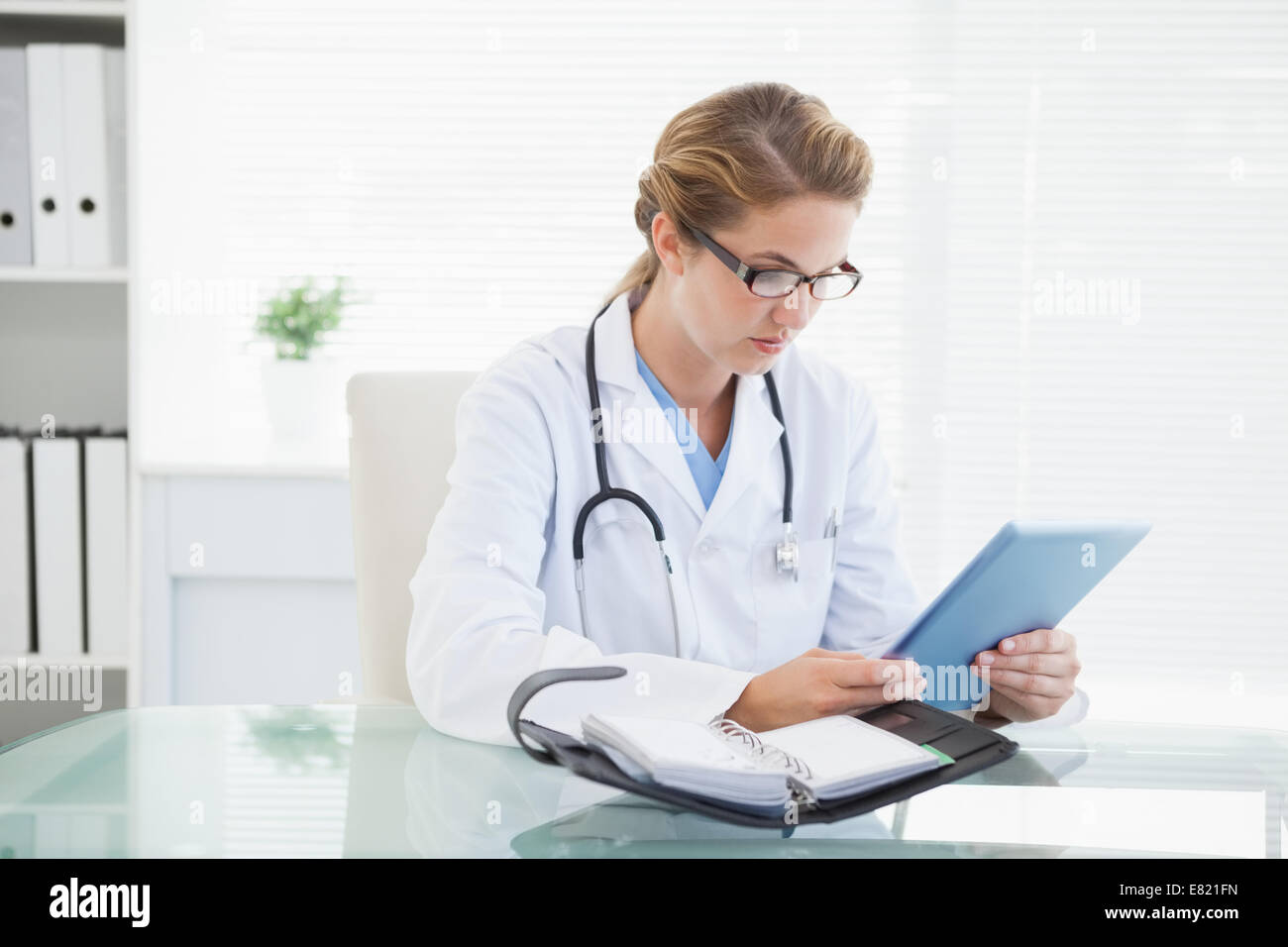 Doctor working desk tablet pc hi-res stock photography and images - Alamy