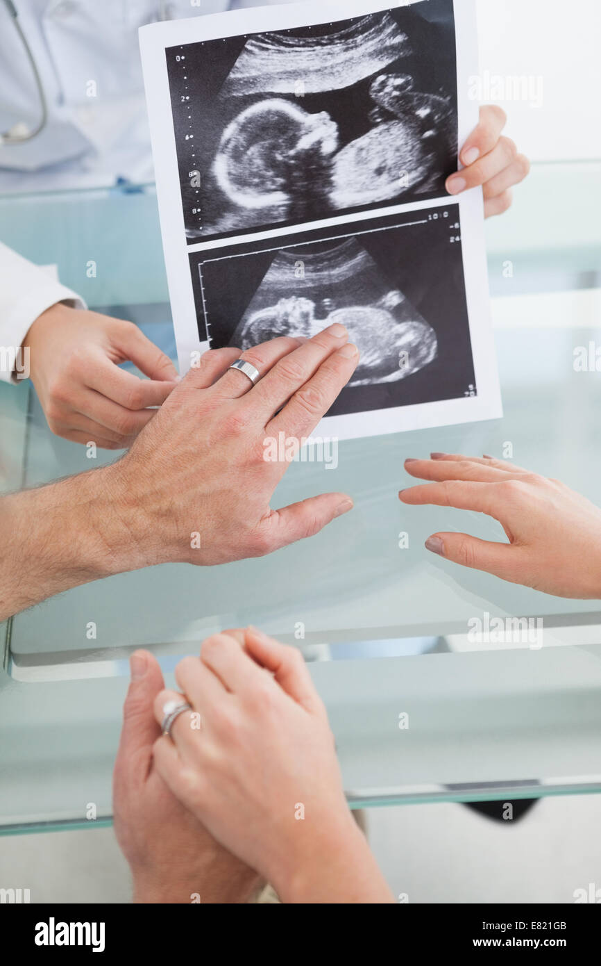 Doctor talking couple hi-res stock photography and images - Alamy