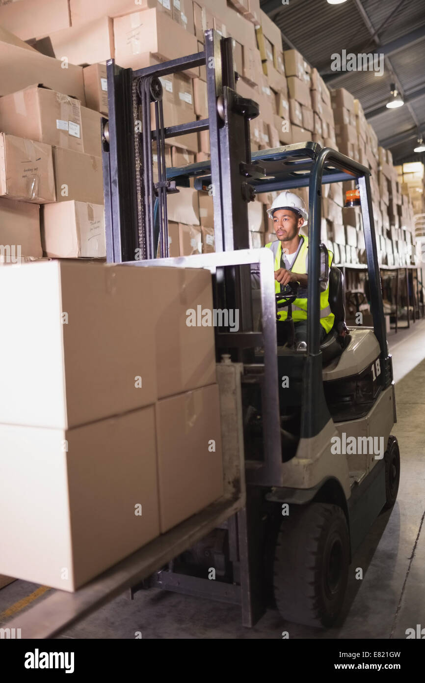 Driver operating forklift machine Stock Photo - Alamy