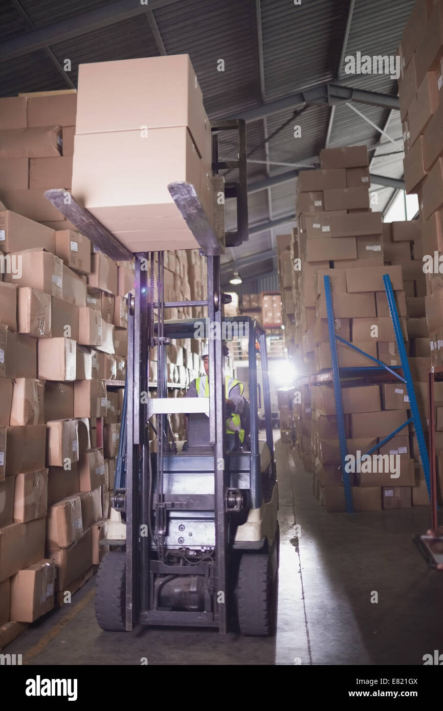 Forklift machine in warehouse Stock Photo - Alamy