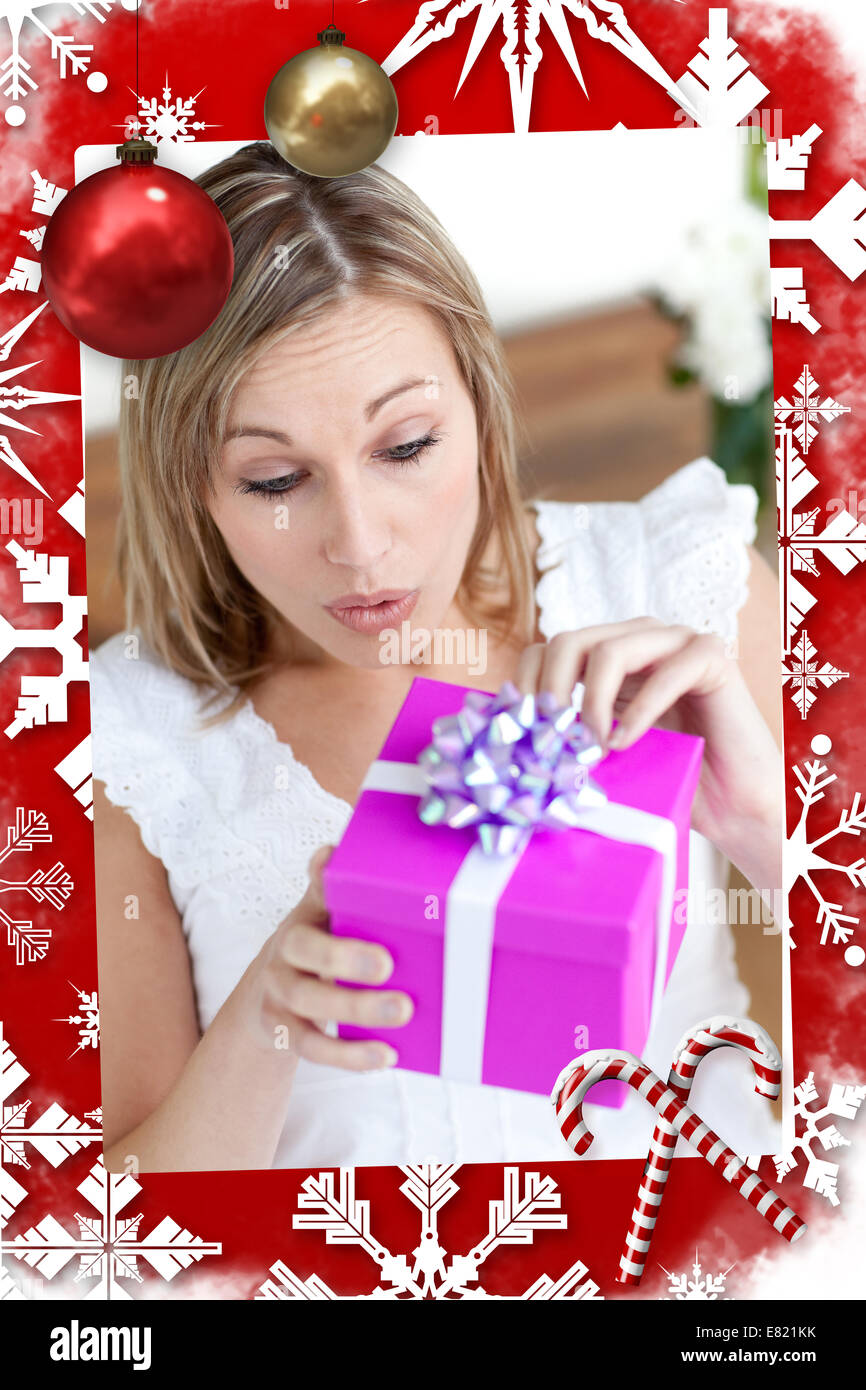 Surprised young woman opening gifts hi-res stock photography and images ...