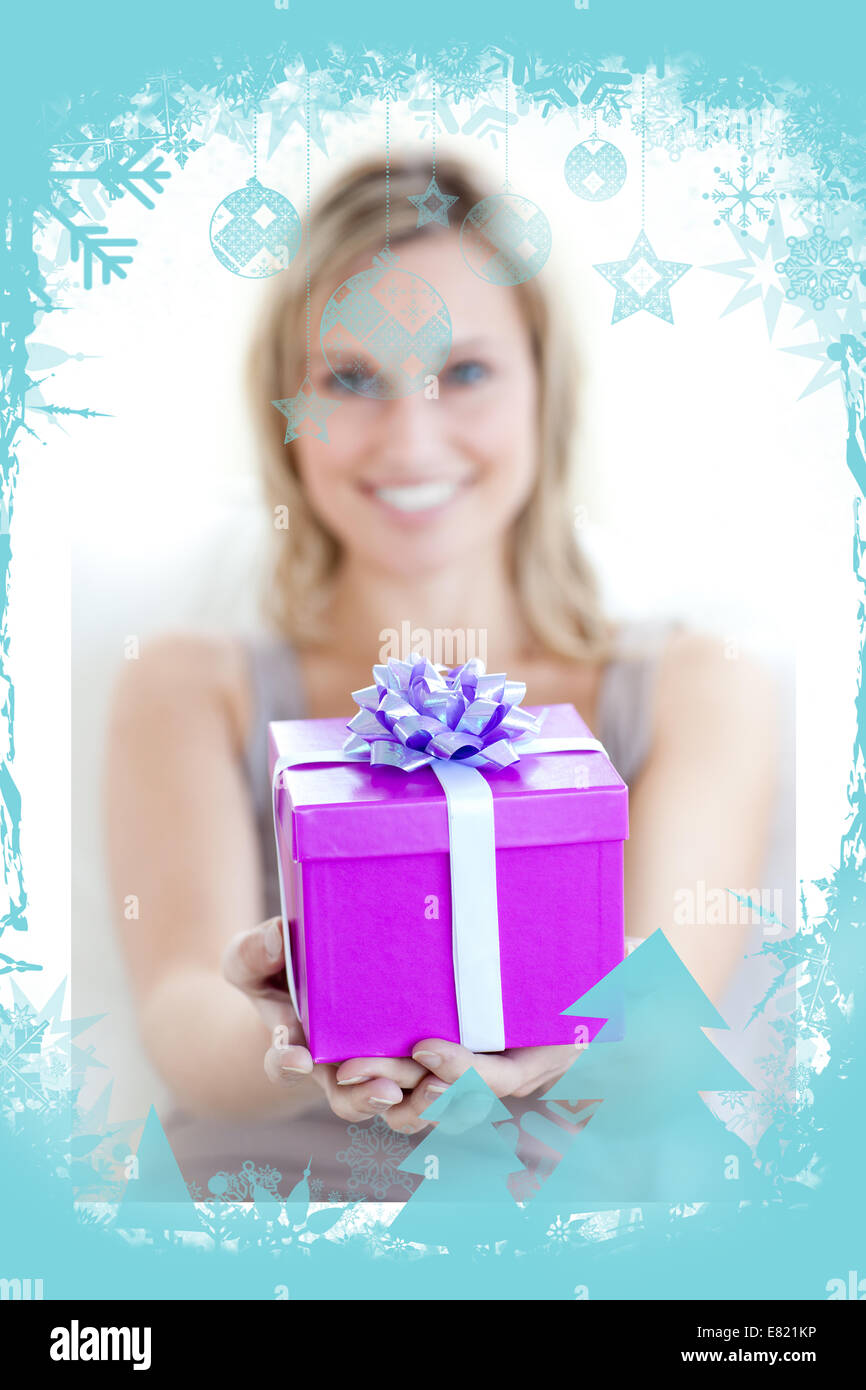 A charming woman is holding a present Stock Photo - Alamy