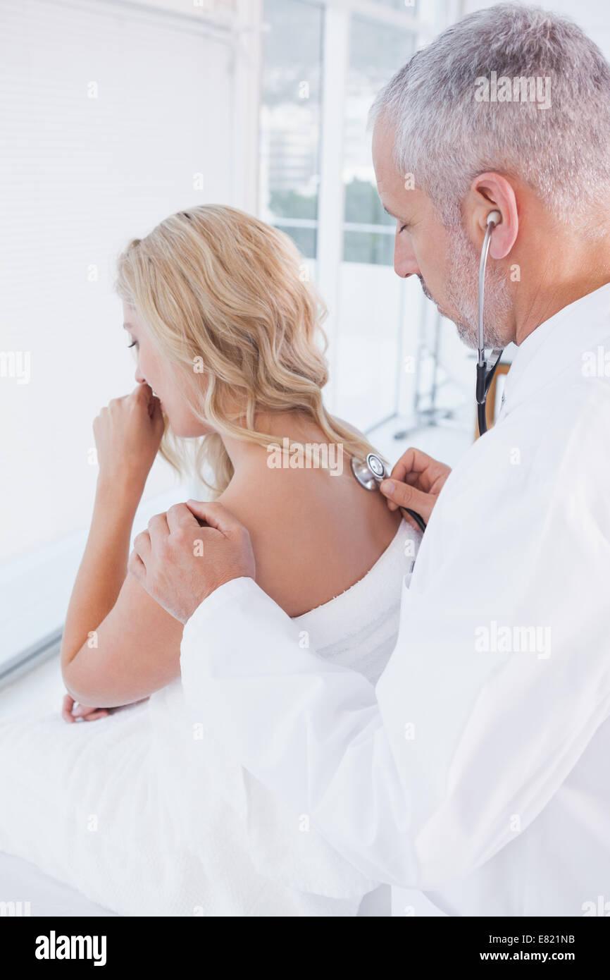 Doctor listening the breathing at his patient Stock Photo - Alamy