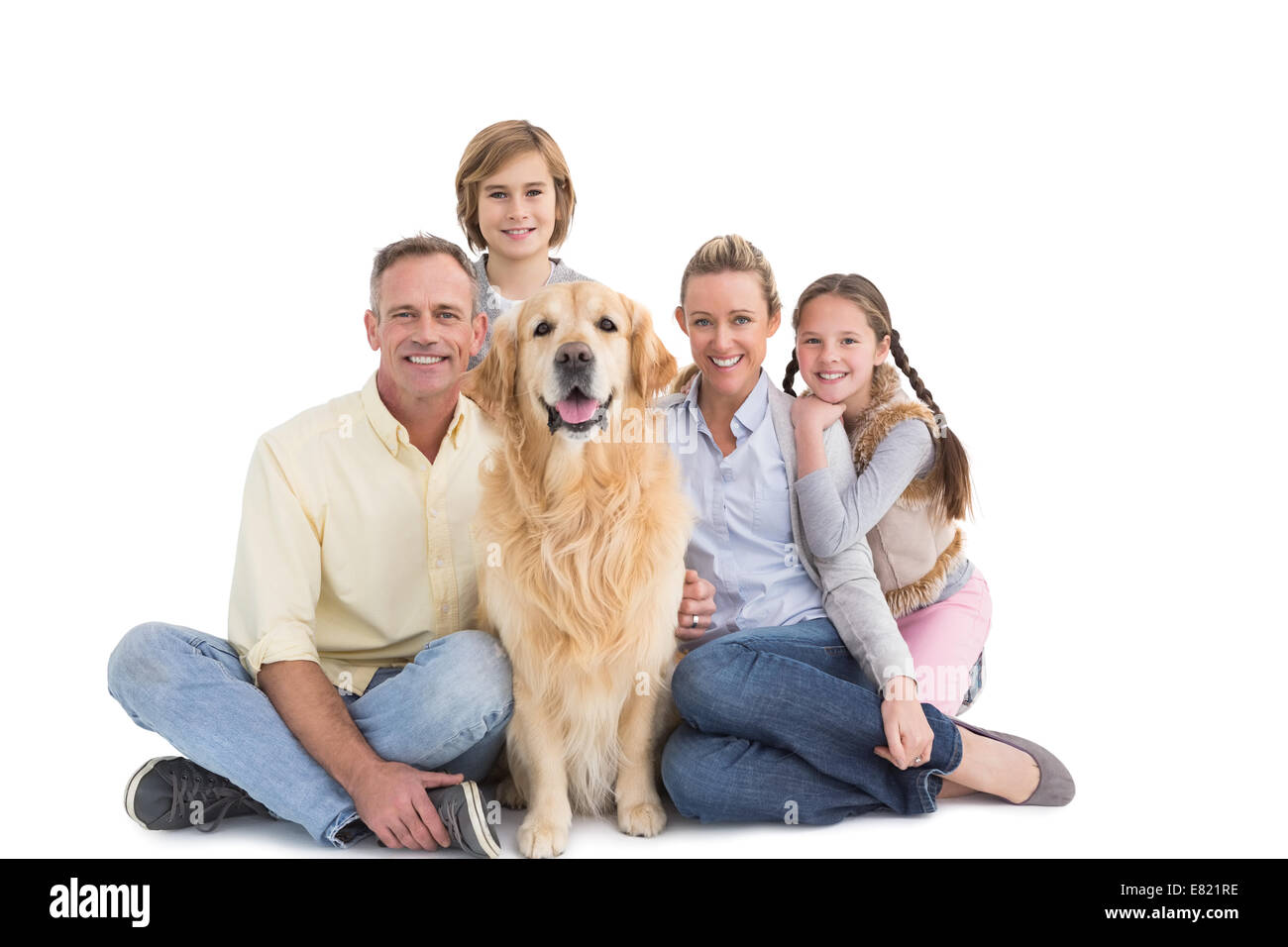 Portrait of smiling family sitting together with their dog Stock Photo ...