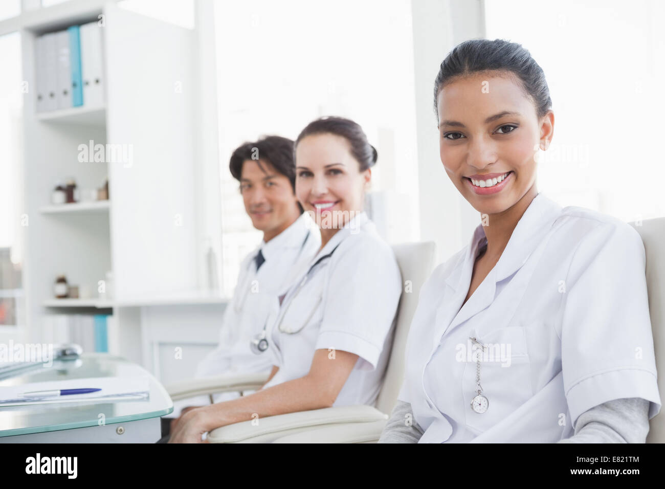 Woman sitting desk beside hi-res stock photography and images - Alamy