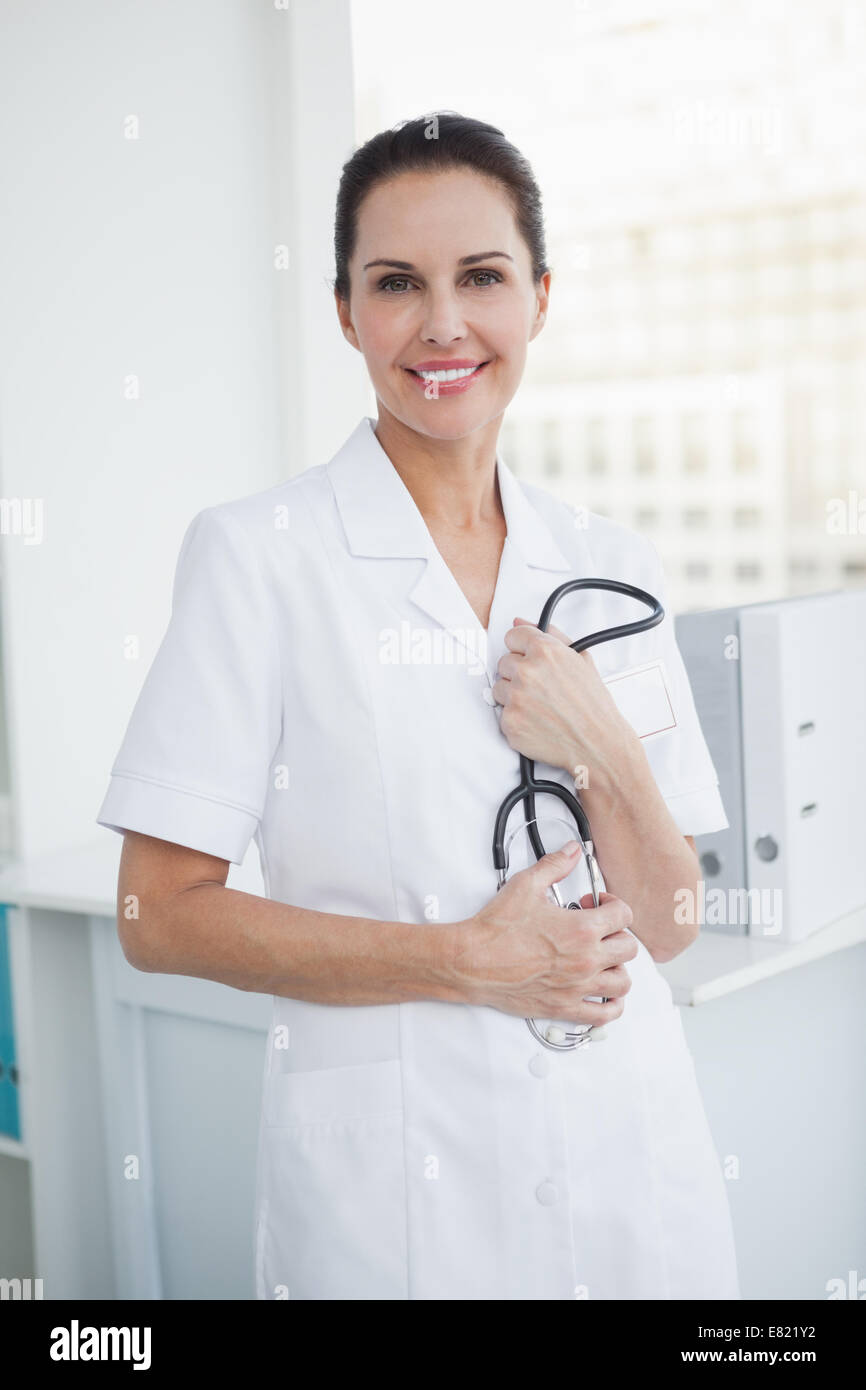 Doctor holding her stethoscope in hand Stock Photo - Alamy