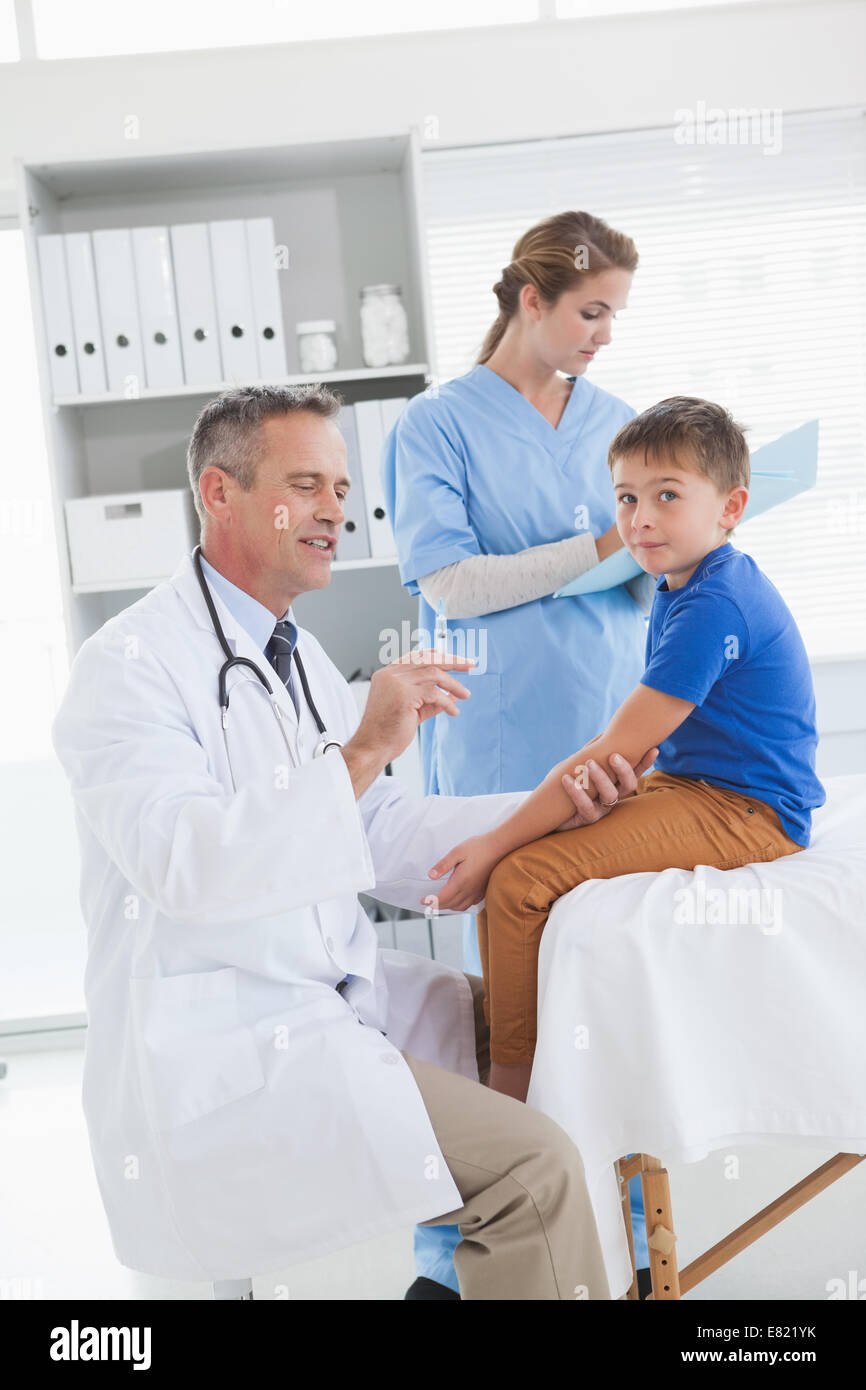 Small boy about to receive an injection Stock Photo - Alamy