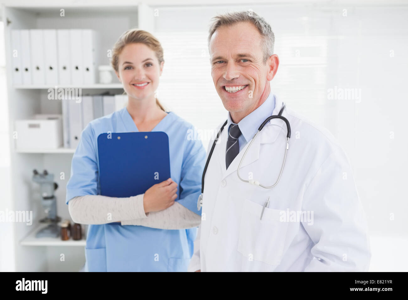 Smiling doctor looking at the camera Stock Photo - Alamy