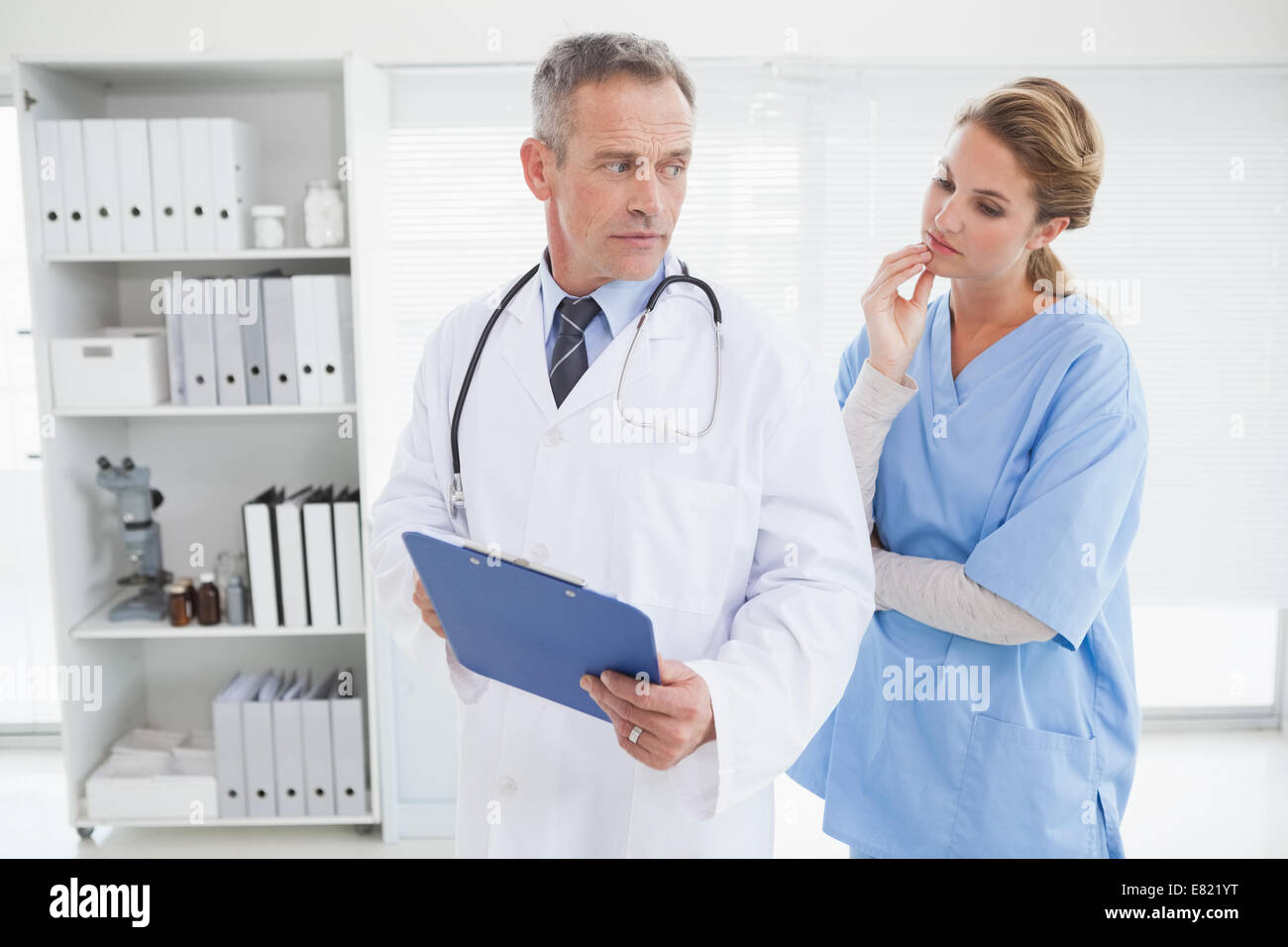 Doctor serious chart hi-res stock photography and images - Alamy