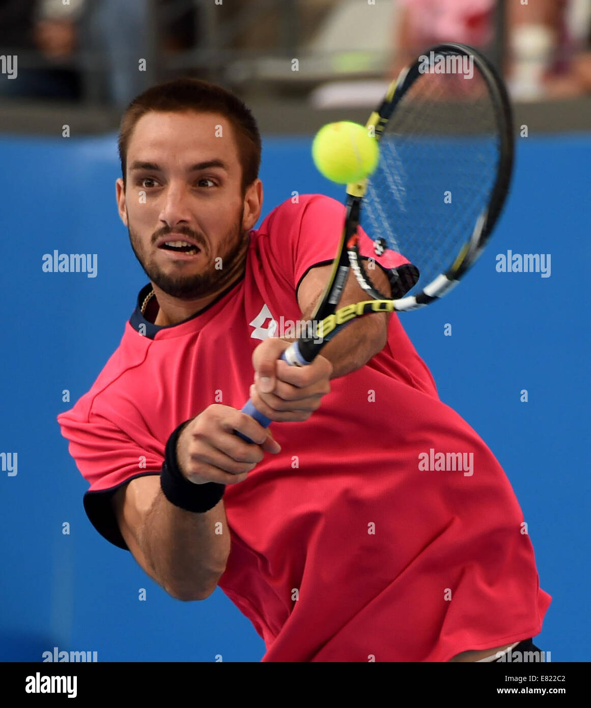 Beijing, China. 29th Sep, 2014. Viktor Troicki of Serbia returns a shot ...