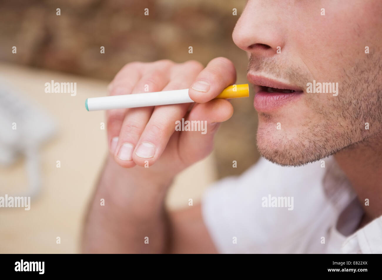 Businessman smoking an electronic cigarette Stock Photo - Alamy