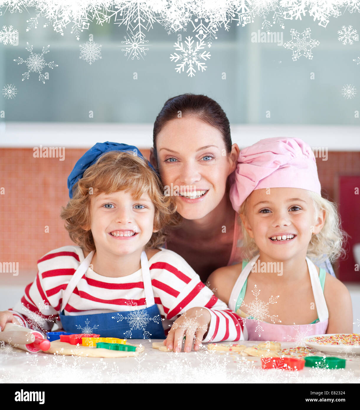 Radiant mother baking with her children Stock Photo - Alamy