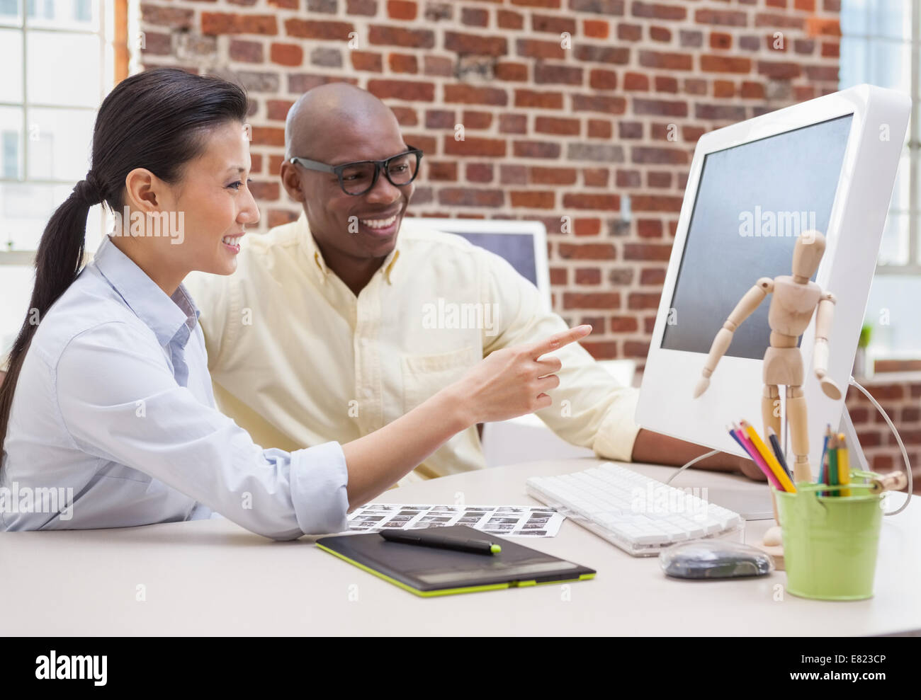 Creative business partners working together Stock Photo - Alamy